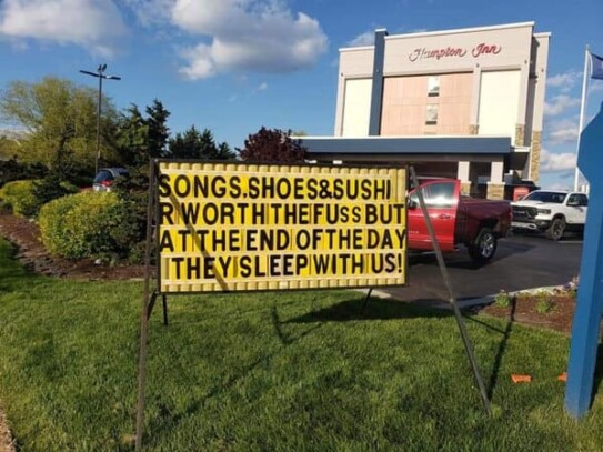19 Pics From The Sign War Going On Between Businesses In Virginia